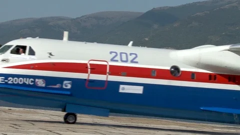 Amphibious aircraft Be-200ES leaves wate... | Stock Video | Pond5