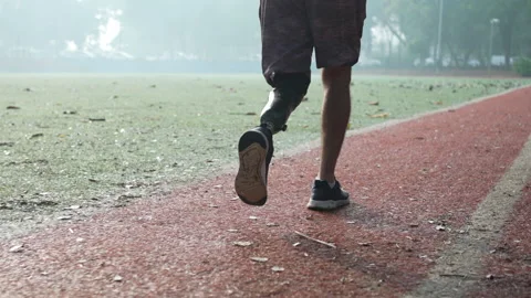 Amputee athlete running with prosthetic ... | Stock Video | Pond5
