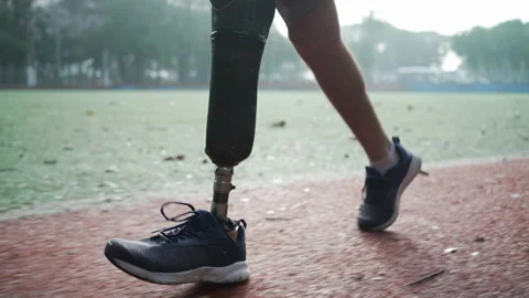 Amputee athlete running with prosthetic ... | Stock Video | Pond5