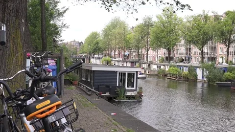 Amsterdam landmarks floating houses on r... | Stock Video | Pond5