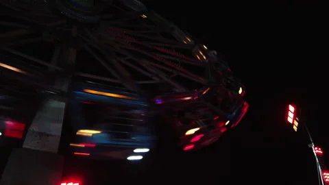 Amusement park attraction spinning ride ... | Stock Video | Pond5