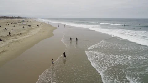 Anaheim Beach: People Walking on a Cloud... | Stock Video | Pond5