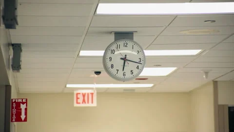 Analog clock on ceiling of hospital hall... | Stock Video | Pond5