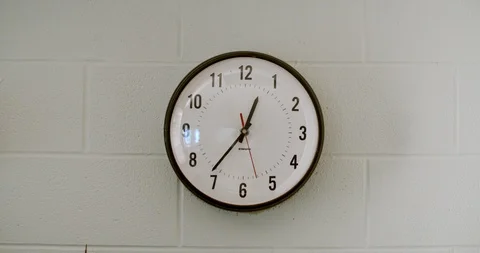 Analog clock on wall in school cafeteria | Stock Video | Pond5