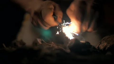 An ancient man lights a fire in a cave. ... | Stock Video | Pond5