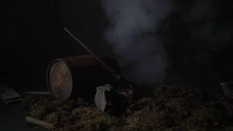 Ancient musket on a barrel among the smo... | Stock Video | Pond5