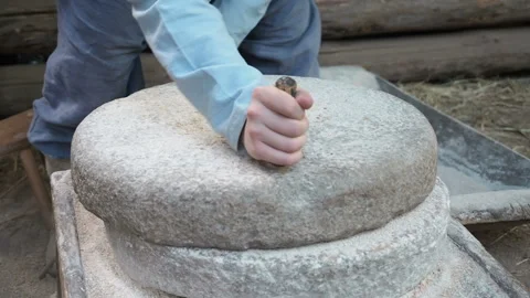 The ancient quern stone hand mill with g... | Stock Video | Pond5