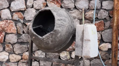 Ancient rumpled concrete mixer laying an... | Stock Video | Pond5