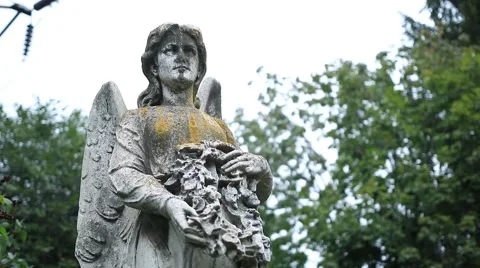 Ancient statue of guardian angel at old ... | Stock Video | Pond5