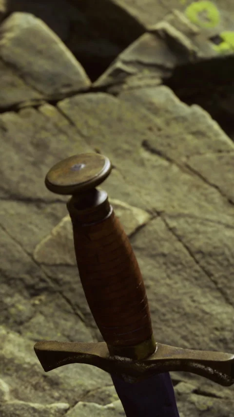 Ancient sword resting on rocky surface i... | Stock Video | Pond5