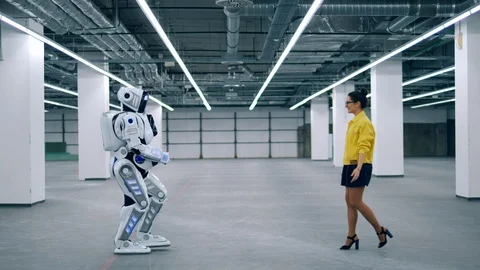 Android and a girl hug, greeting each ot... | Stock Video | Pond5