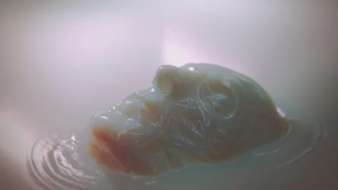 Android or alien body emerging from liqu... | Stock Video | Pond5