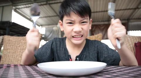 Angry asian child waiting food for launc... | Stock Video | Pond5