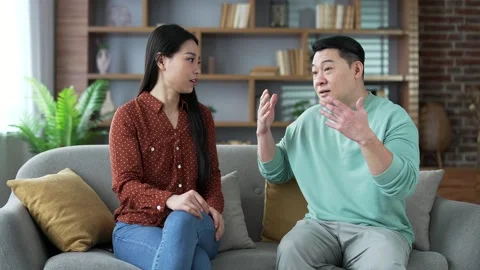 Angry asian husband and wife arguing sit... | Stock Video | Pond5