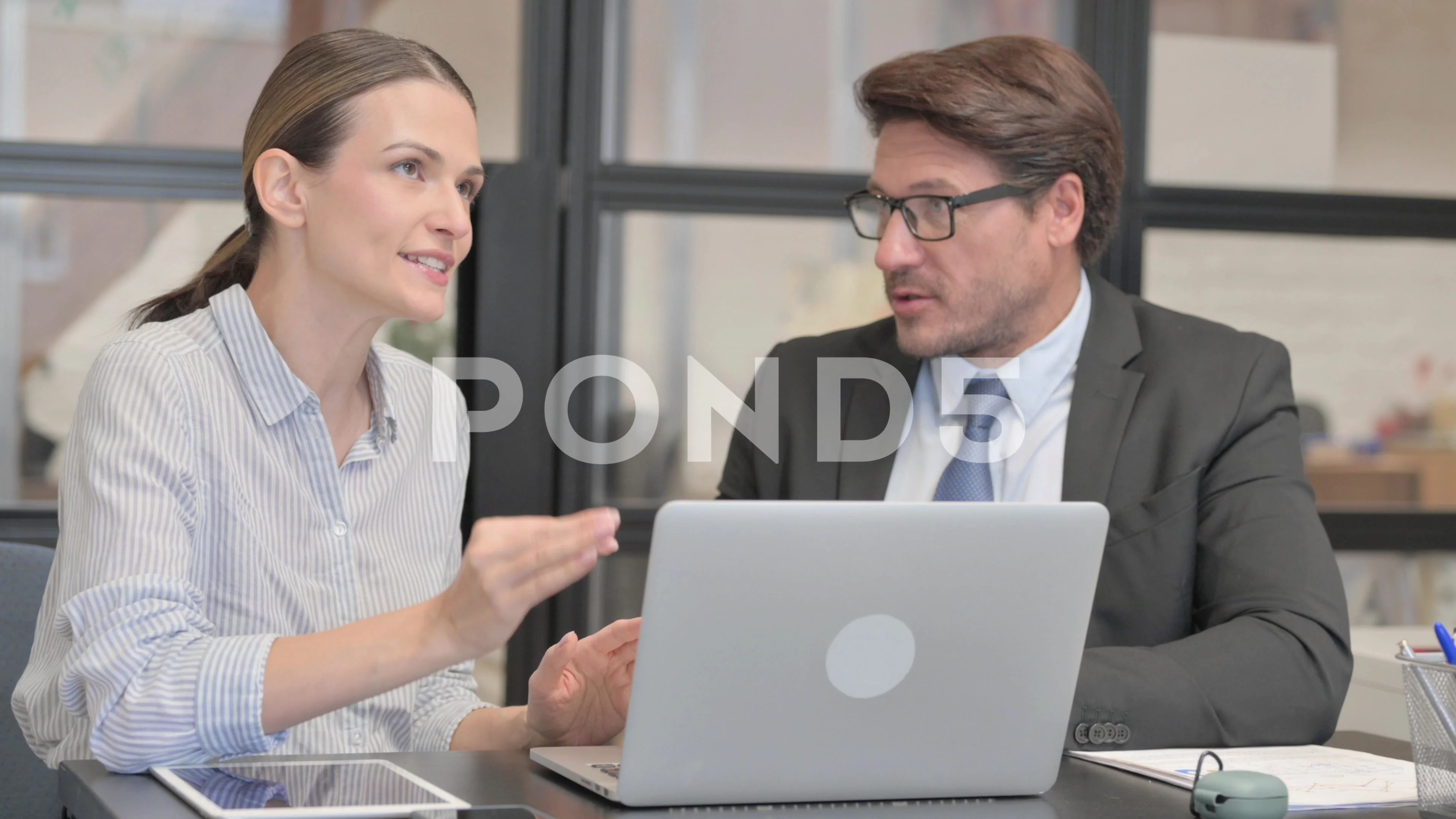 People Arguing At Work