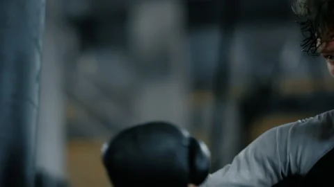 Angry fighter doing workout in sport clu... | Stock Video | Pond5