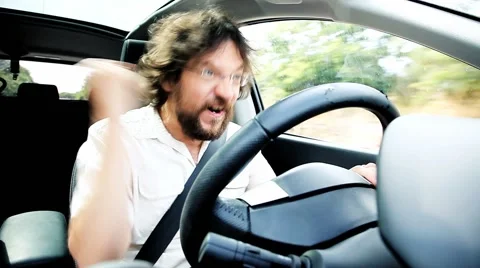 Angry furious man shouting while driving... | Stock Video | Pond5