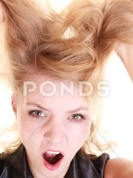 Angry furious woman screaming and pulling messy hair ~ Hi Res #65408598