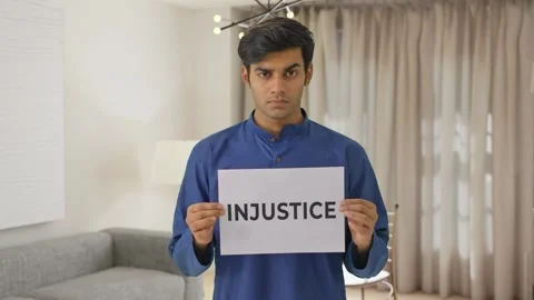 Angry Indian boy holding INJUSTICE banne... | Stock Video | Pond5