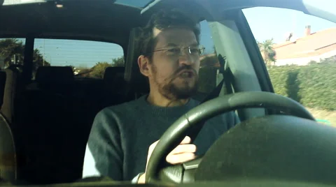 Angry man in car driving shouting | Stock Video | Pond5