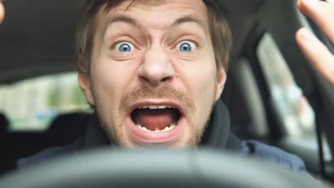 Angry man driving a car. Male driver scr... | Stock Video | Pond5