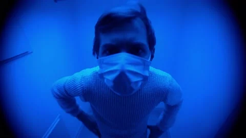 An angry man knocks on the door at night... | Stock Video | Pond5