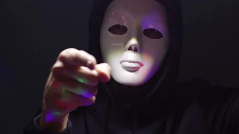 angry man in mask and hoody pointing fin... | Stock Video | Pond5