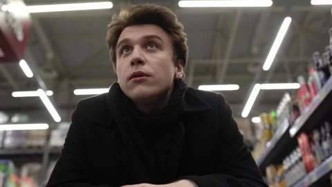 An angry man is standing in line at a su... | Stock Video | Pond5