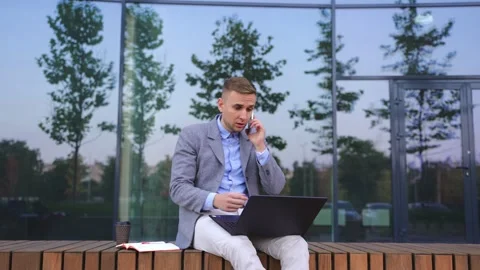 Angry man working with laptop, talking o... | Stock Video | Pond5