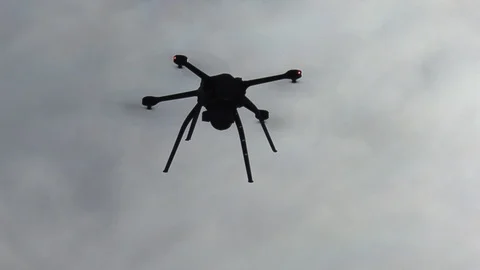 Angry menacing drone flying in the sky | Stock Video | Pond5