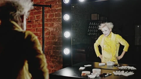Angry mime looks at reflection in mirror... | Stock Video | Pond5