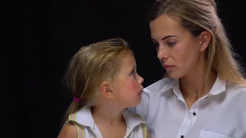 Angry mother looks at her beaten up daug... | Stock Video | Pond5