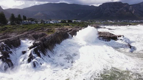 Angry ocean wave crash into rocky shorel... | Stock Video | Pond5