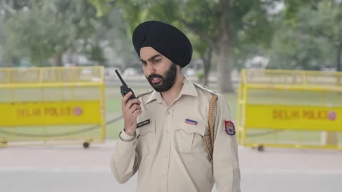 Angry Sikh Indian police man talking on ... | Stock Video | Pond5