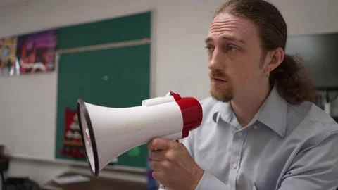 Angry teacher shouting in classroom into... | Stock Video | Pond5