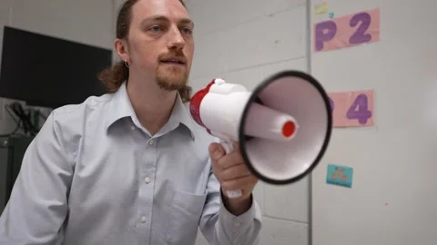 Angry teacher shouting in classroom into... | Stock Video | Pond5