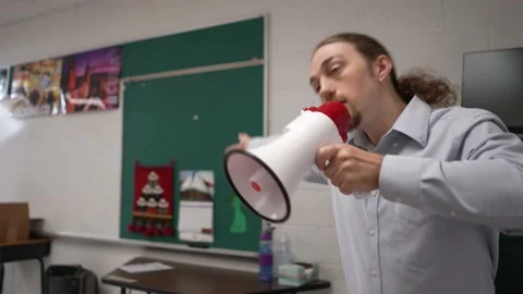 Angry teacher shouting in classroom into... | Stock Video | Pond5