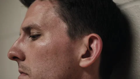 Angry, unhappy, sad prison inmate. Man d... | Stock Video | Pond5