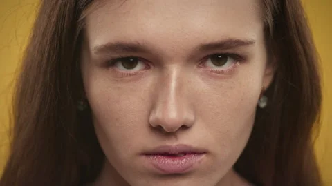 Angry Woman Face Looking At Camera on Ye... | Stock Video | Pond5