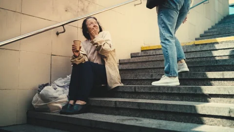 Angry woman showing aggression to homele... | Stock Video | Pond5