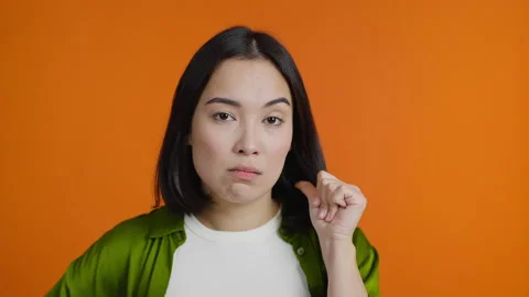 Angry woman shows cutting throat gesture... | Stock Video | Pond5