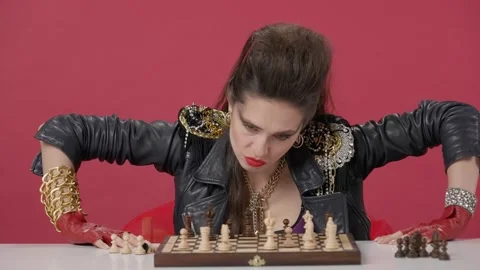 Angry woman sits at a table with chessin... | Stock Video | Pond5