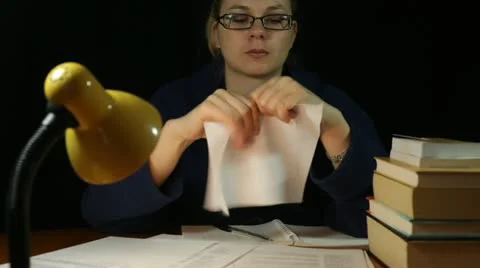 Angry woman tearing up paper | Stock Video | Pond5