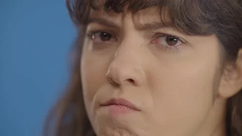 An angry young woman biting her lips on ... | Stock Video | Pond5