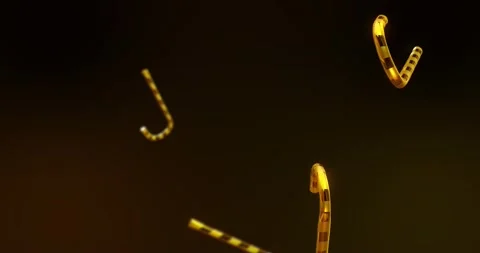Animation of gold candy canes falling ov... | Stock Video | Pond5