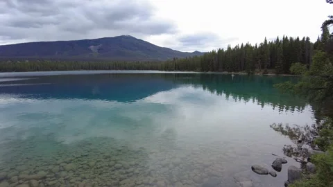 Annette Lake with a mountain range in th... | Stock Video | Pond5