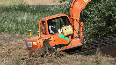 An anphibious digger being used for cons... | Stock Video | Pond5