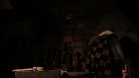 Anvil and smith is on a background | Stock Video | Pond5