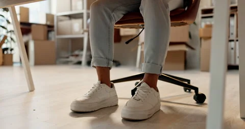 Anxiety, work and tapping feet at a desk... | Stock Video | Pond5