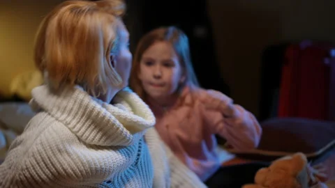 Anxious mother hugging scared daughter a... | Stock Video | Pond5